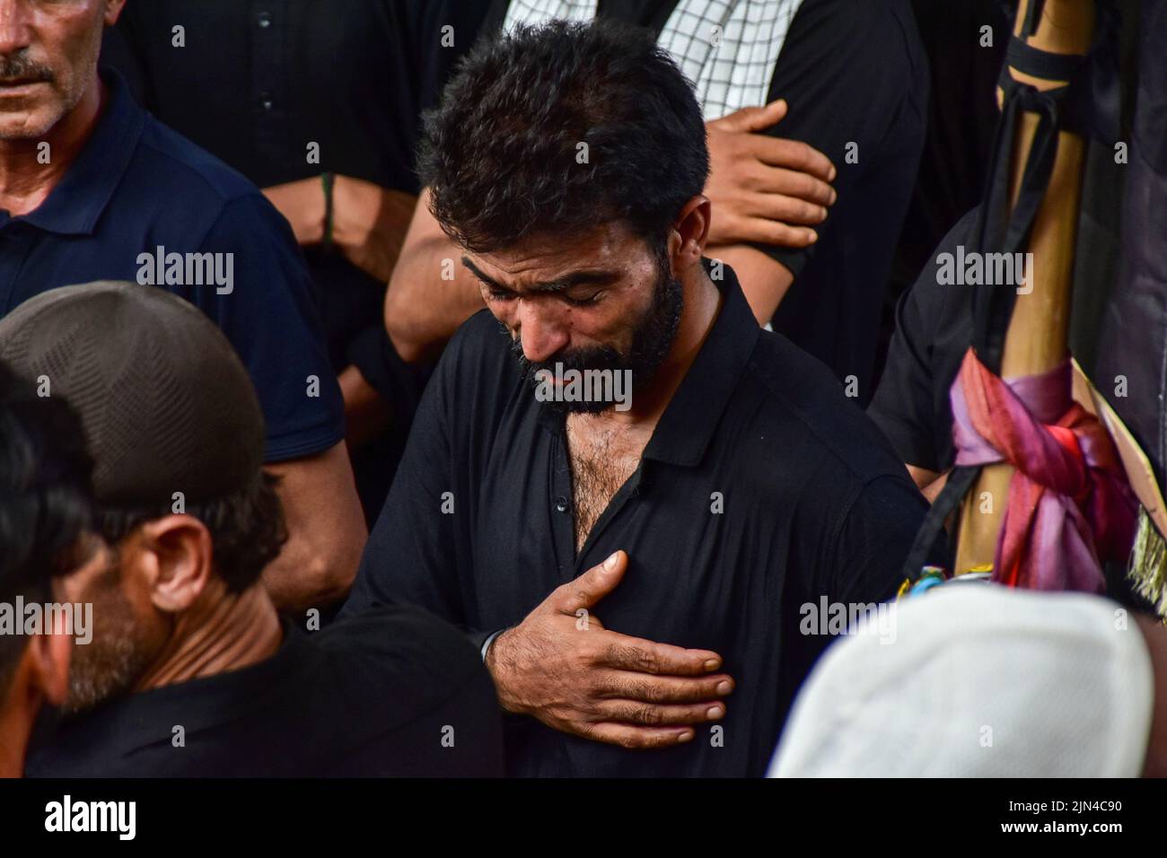A Kashmiri Shiite Muslim participates in a mourning ritual during a ...