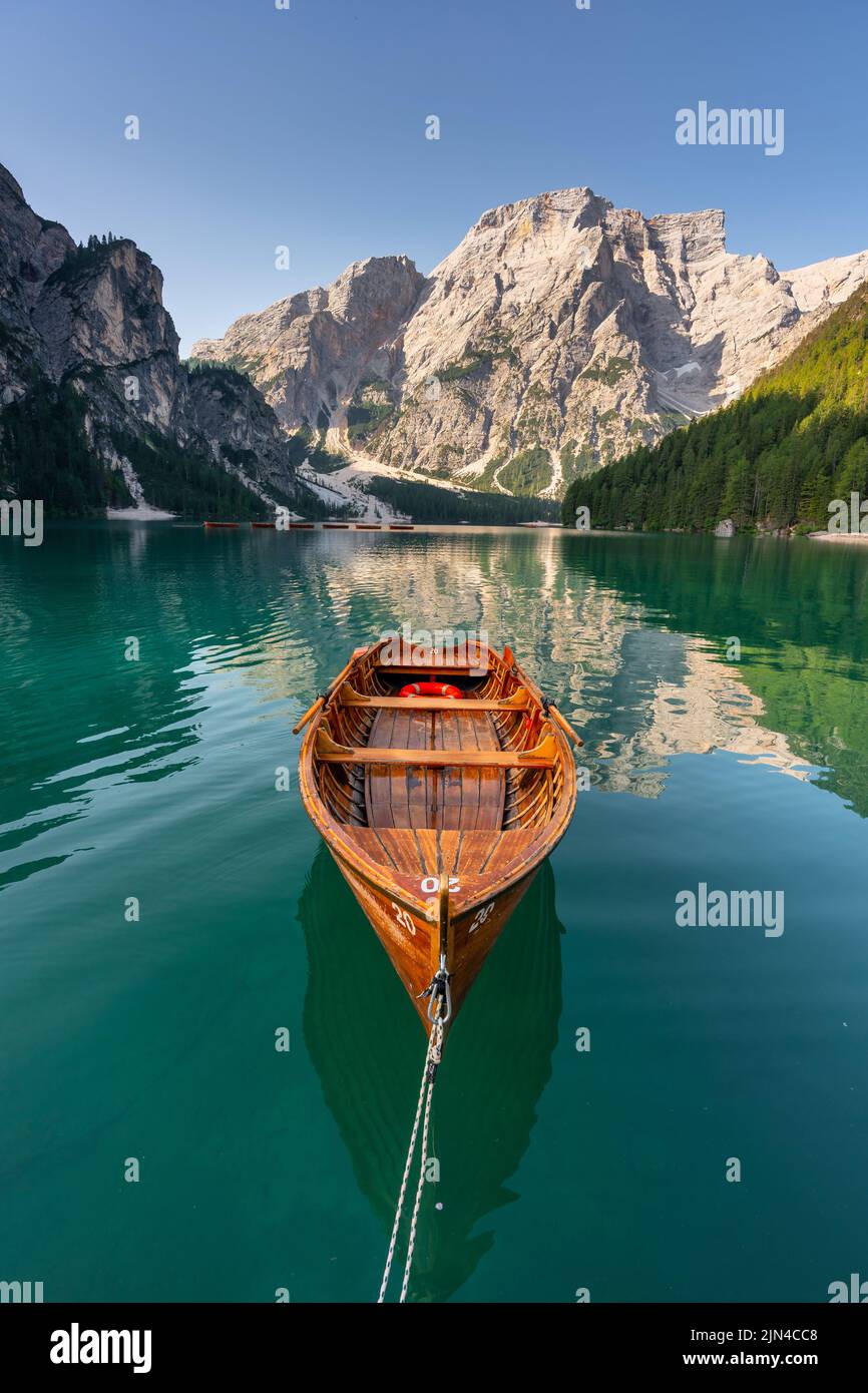 Amazing Sunrise view of Lago di Braies (Pragser Wildsee) with Wooden boats, one of the most ...