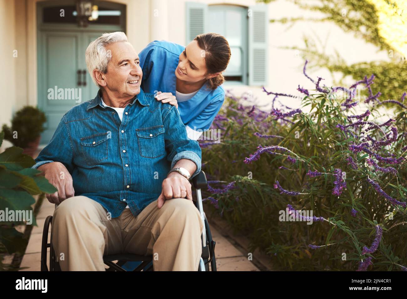 Some time in the garden will do you well. a young female nurse outside ...