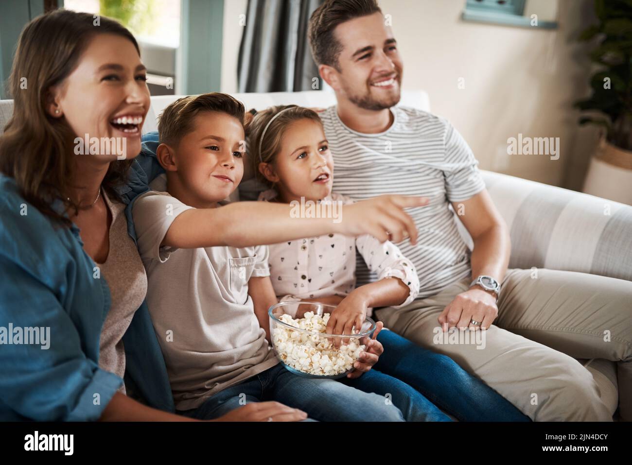 Family time before anything else. a happy young family relaxing on the ...
