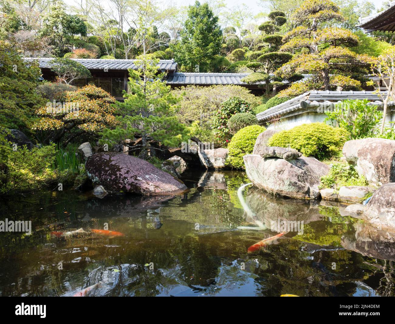 Sukumo, Japan - April 8, 2018: Traditional Japanese garden with pond on ...