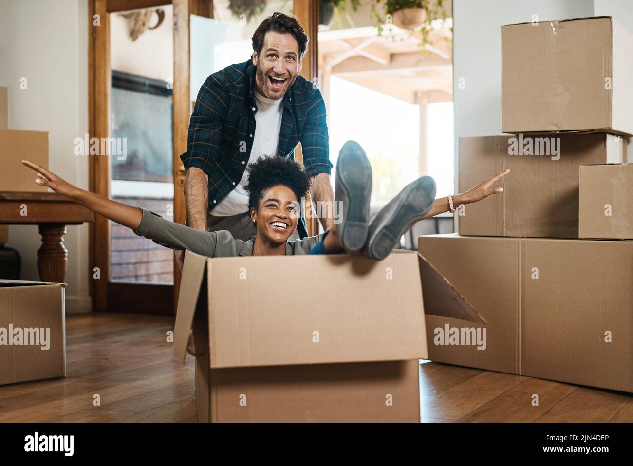 Were already enjoying our new home. a couple being playful in their new ...