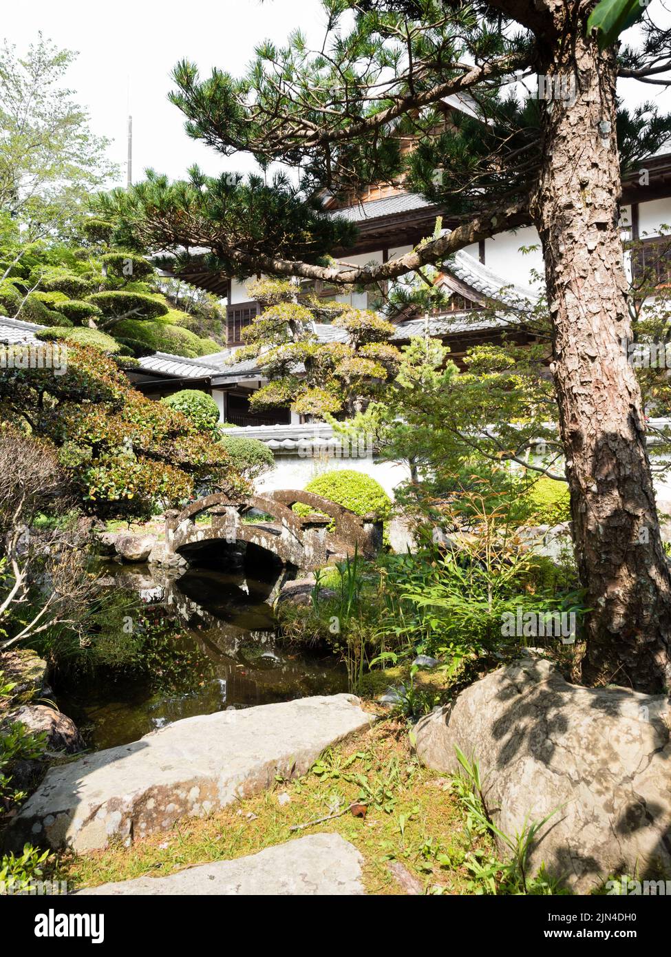 Sukumo, Japan - April 8, 2018: Traditional Japanese garden with pond on ...