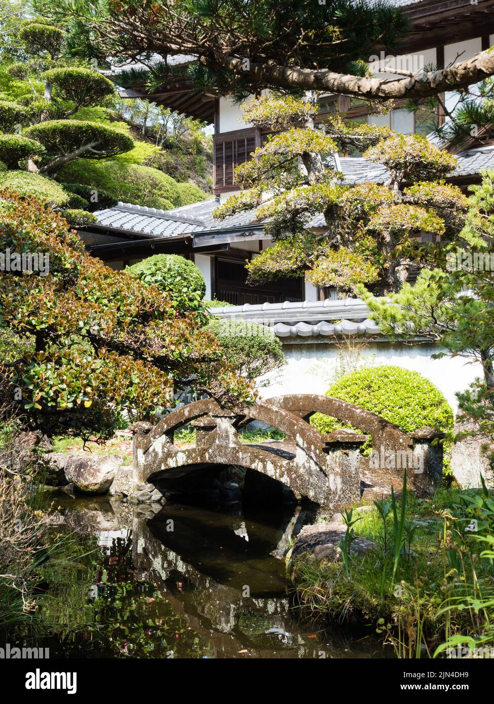 Sukumo, Japan - April 8, 2018: Traditional Japanese garden with pond on ...