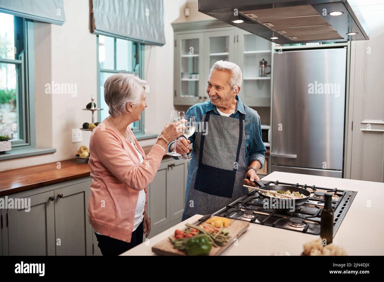 Lets toast to the love that keeps us going. a couple making a toast ...