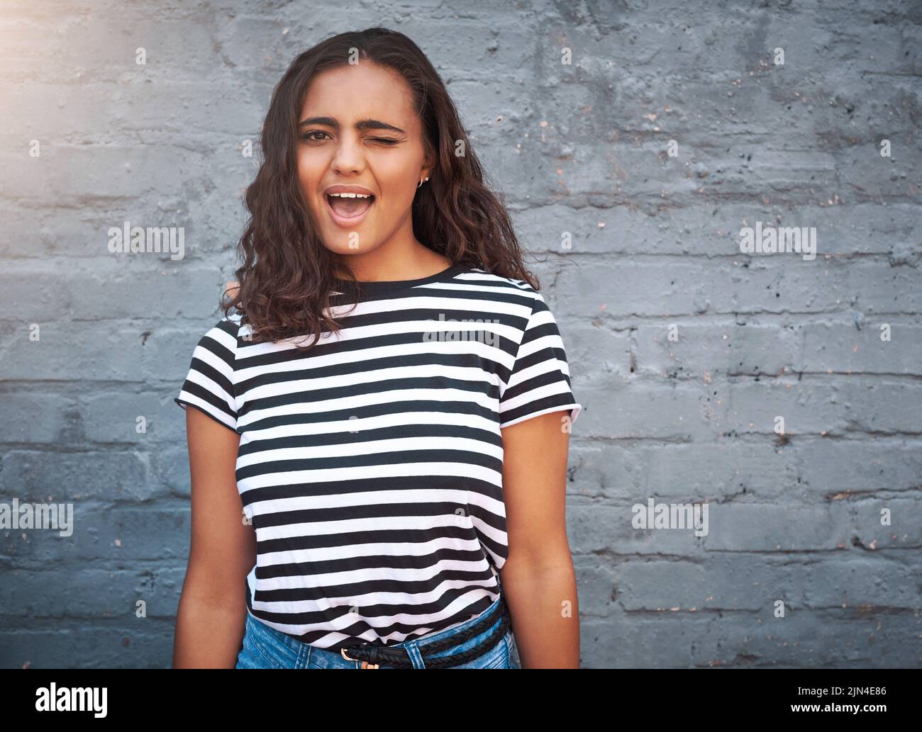 Woman winking and smiling hi-res stock photography and images - Alamy