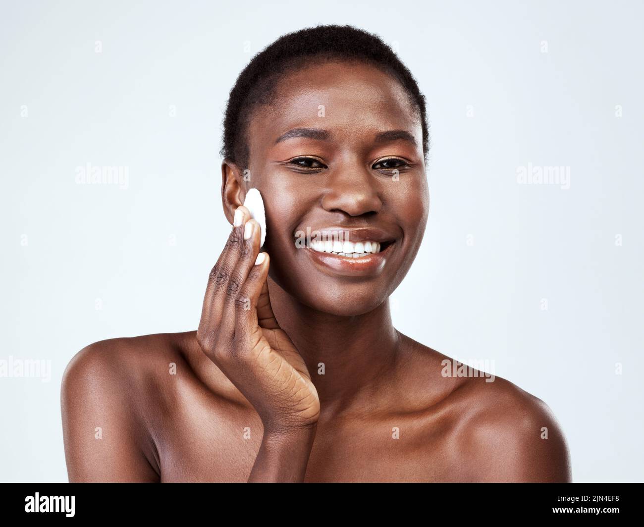 My go to makeup remover. Studio portrait of a beautiful young woman ...