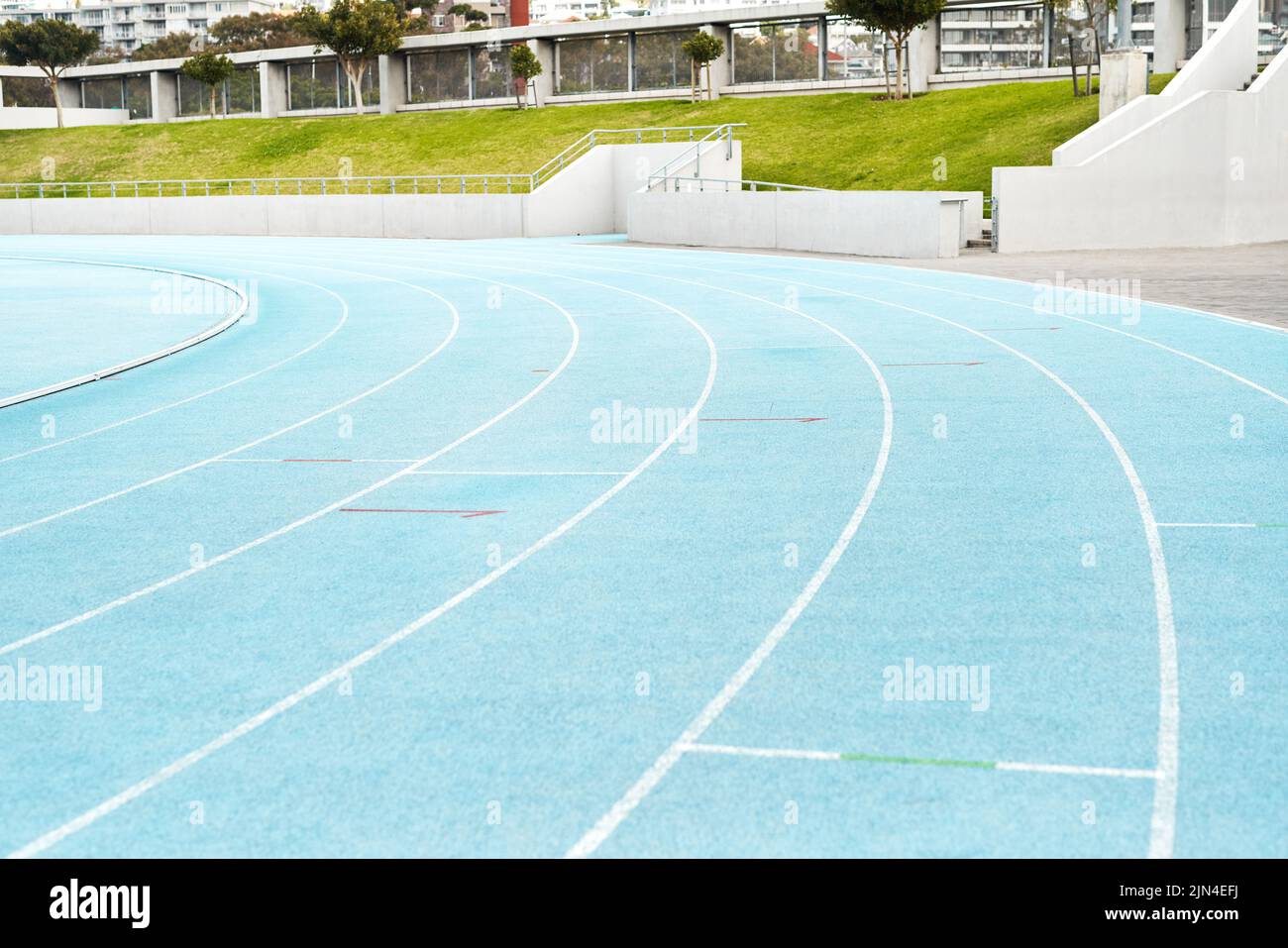 The calm before the storm. an empty athletic track field in a stadium ...