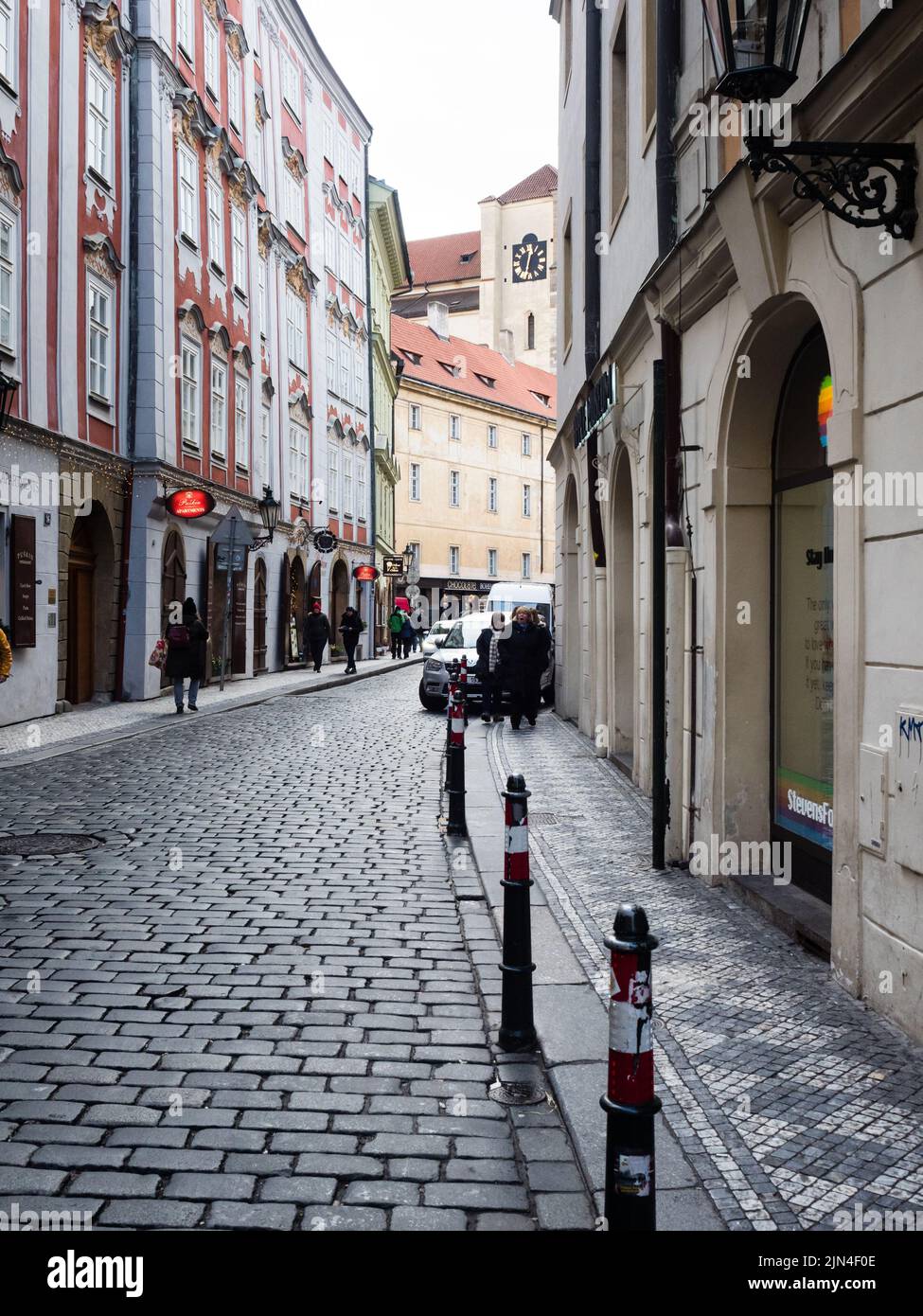 Prague, Czech Republic - December 12, 2018: Narrow cobblestone street ...
