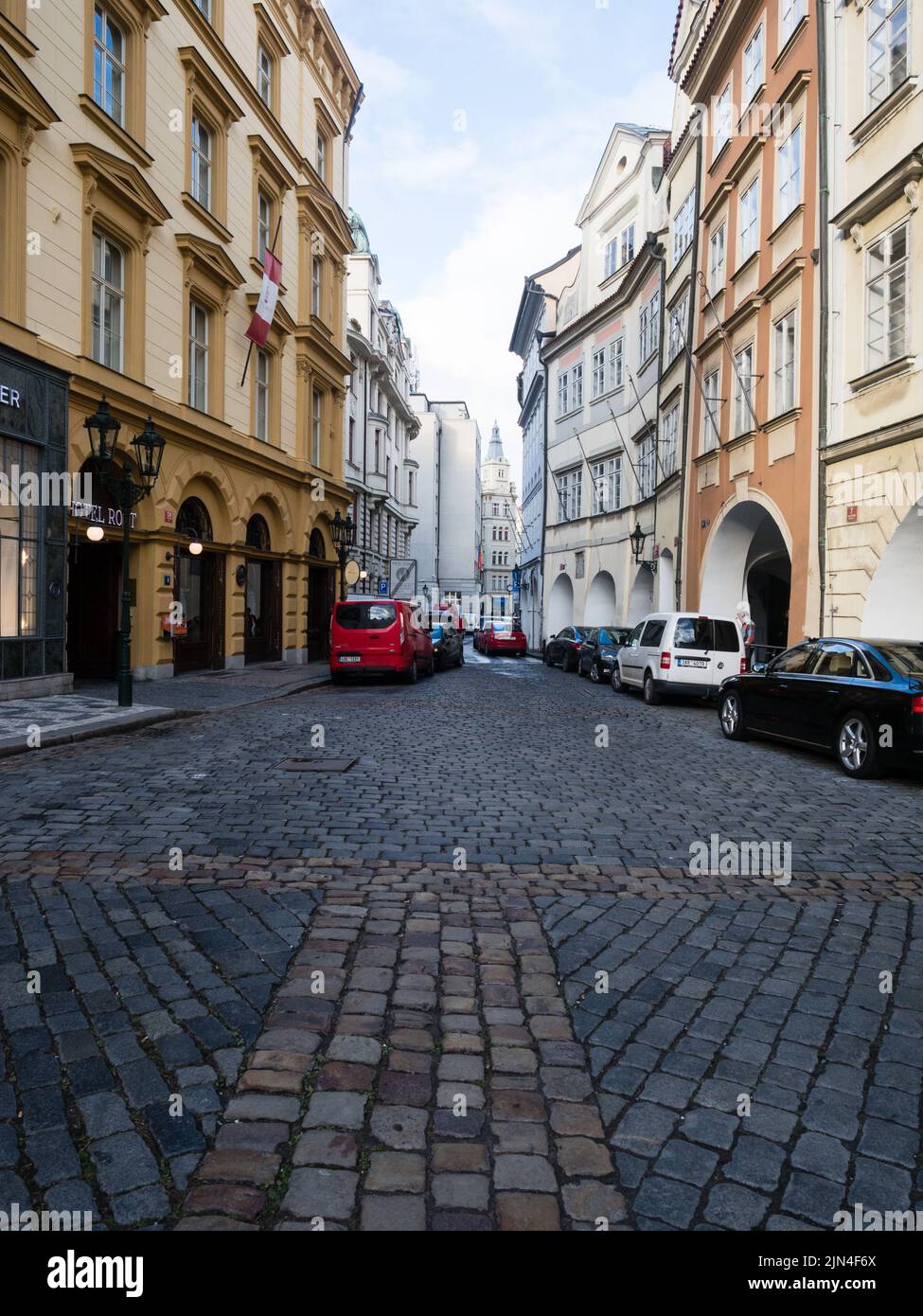 Prague, Czech Republic - December 12, 2018: Narrow cobblestone street ...