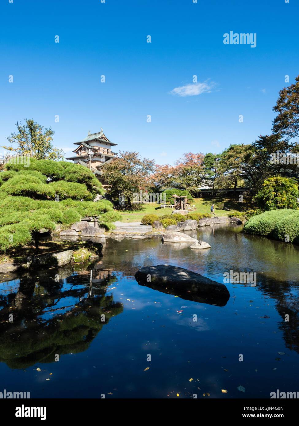 Traditional Japanese public garden with pond near reconstructed ...