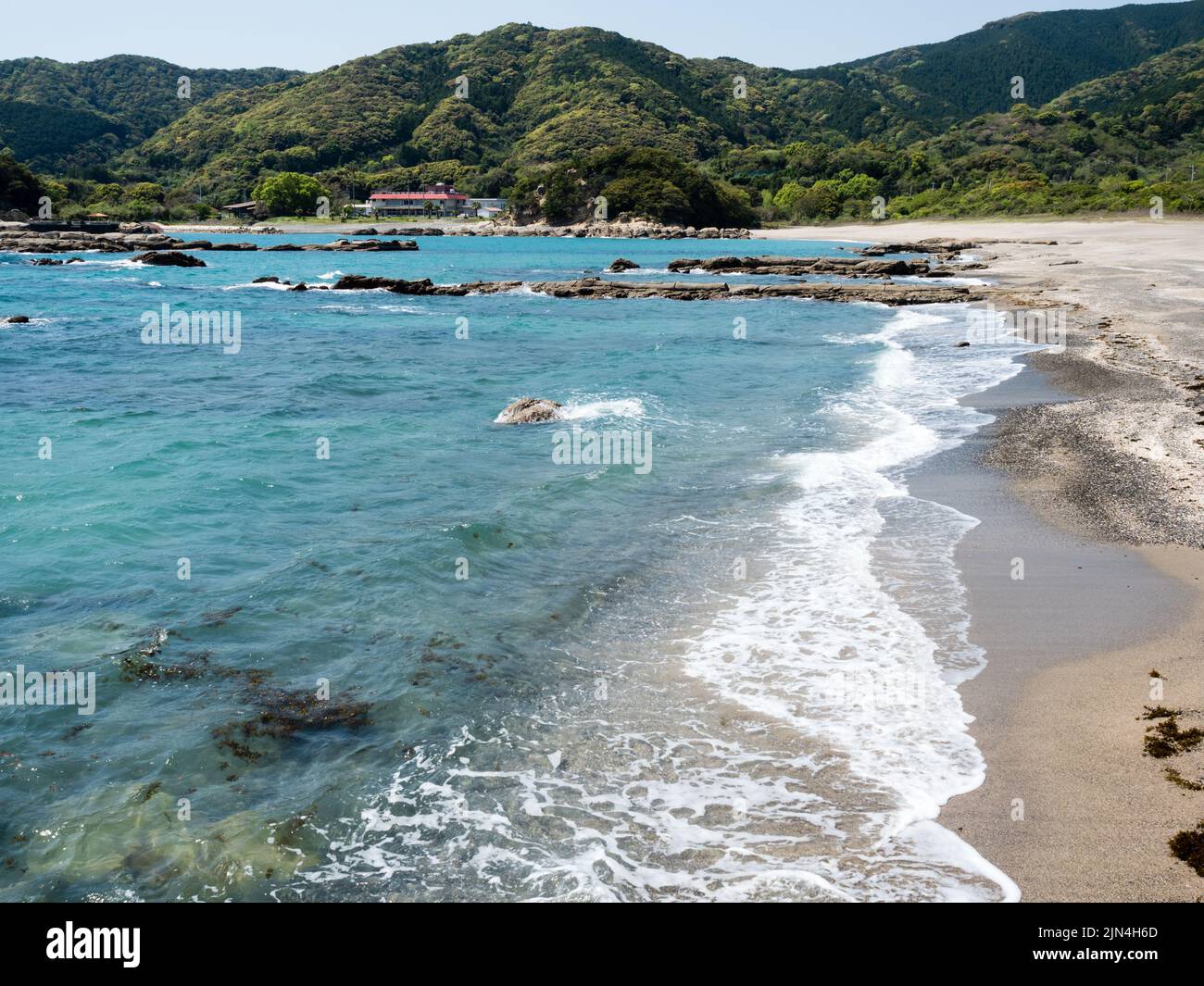 Rocky beach with clear blue waters at Tatsukushi coast - a natural ...
