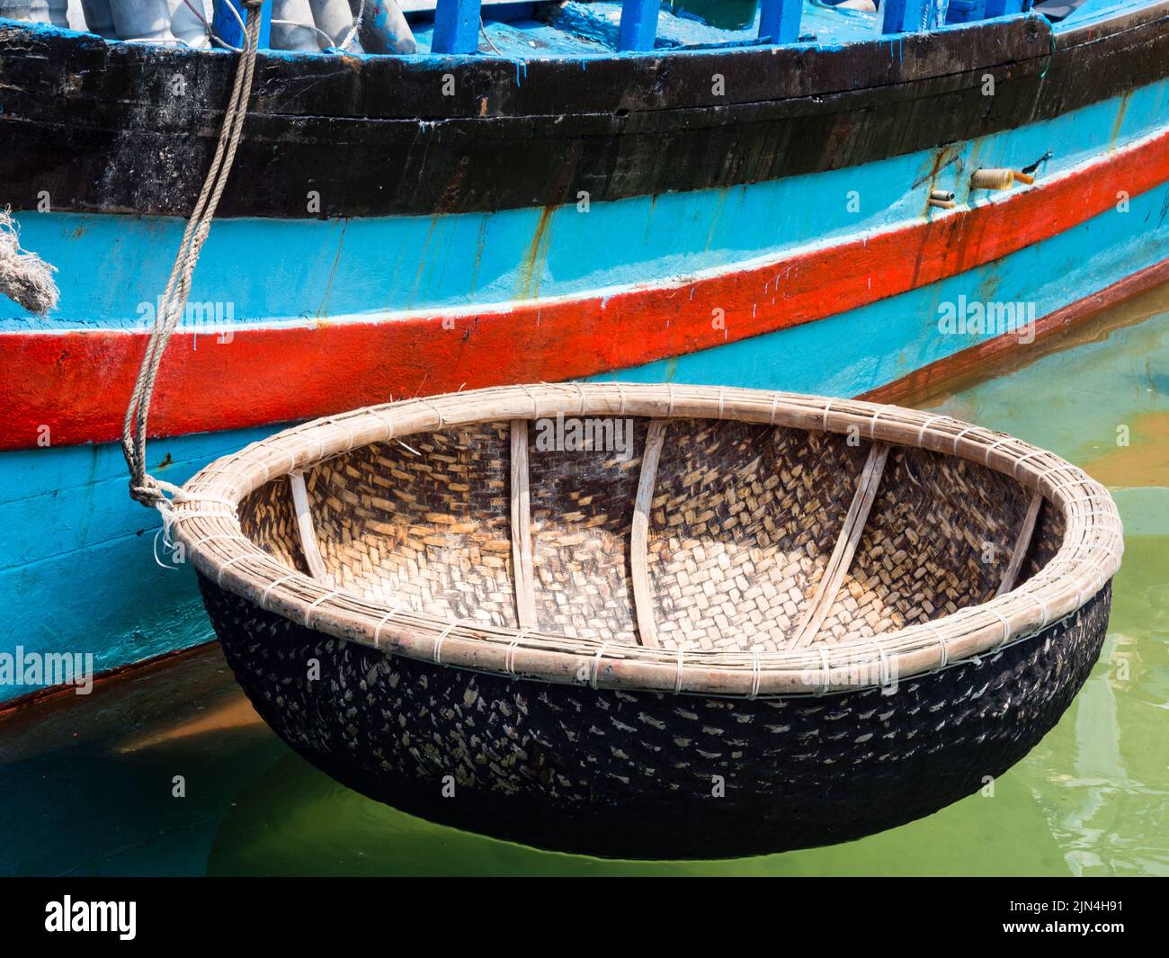 Round rowing basket attached to a fishing boat in Vietnam Stock Photo ...