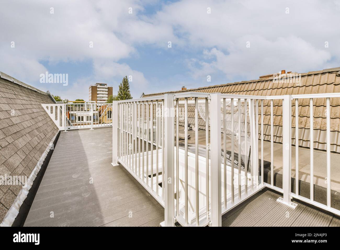 Bright brick balcony with metal railings and door Stock Photo - Alamy