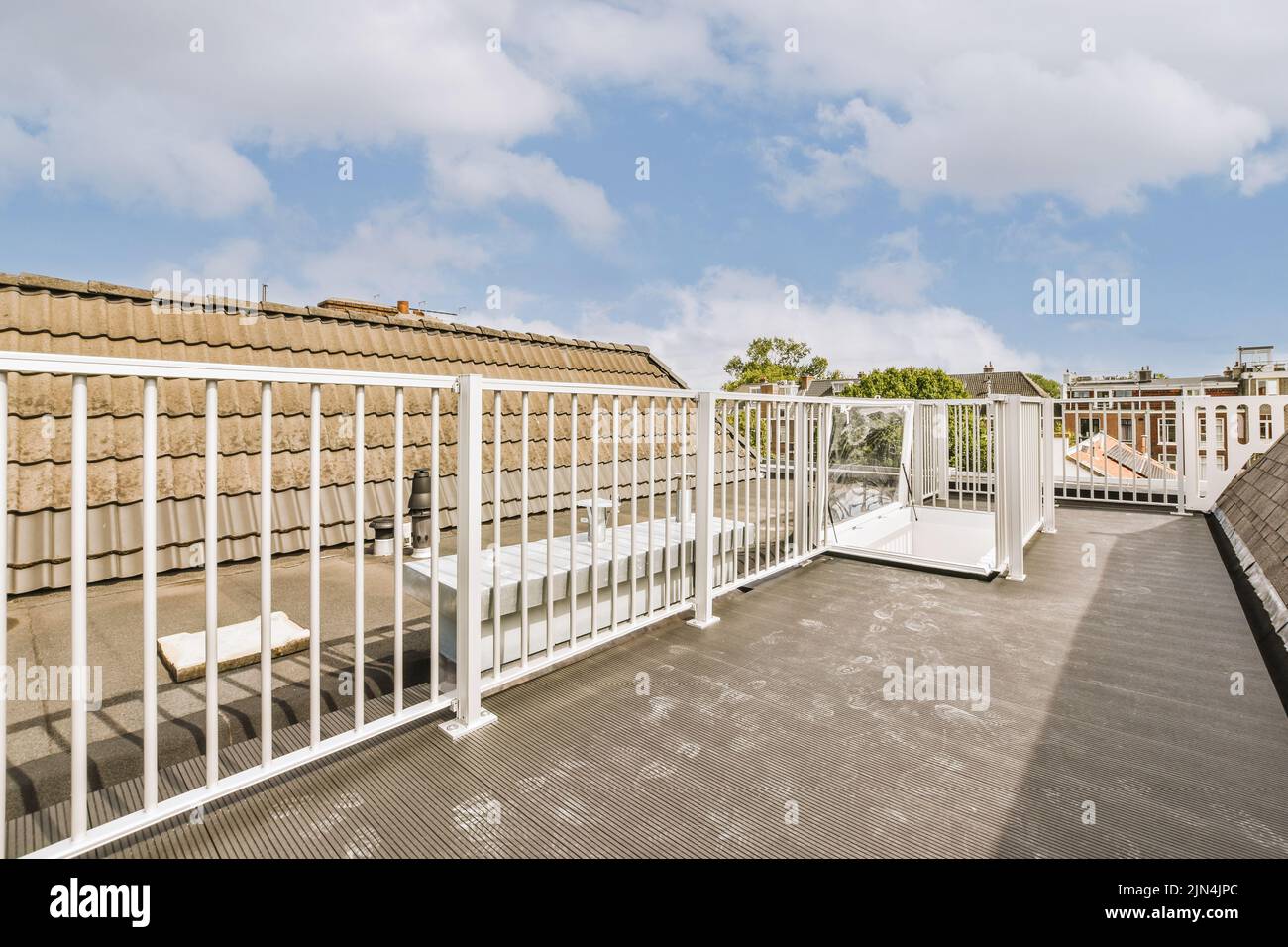 Bright brick balcony with metal railings and door Stock Photo - Alamy