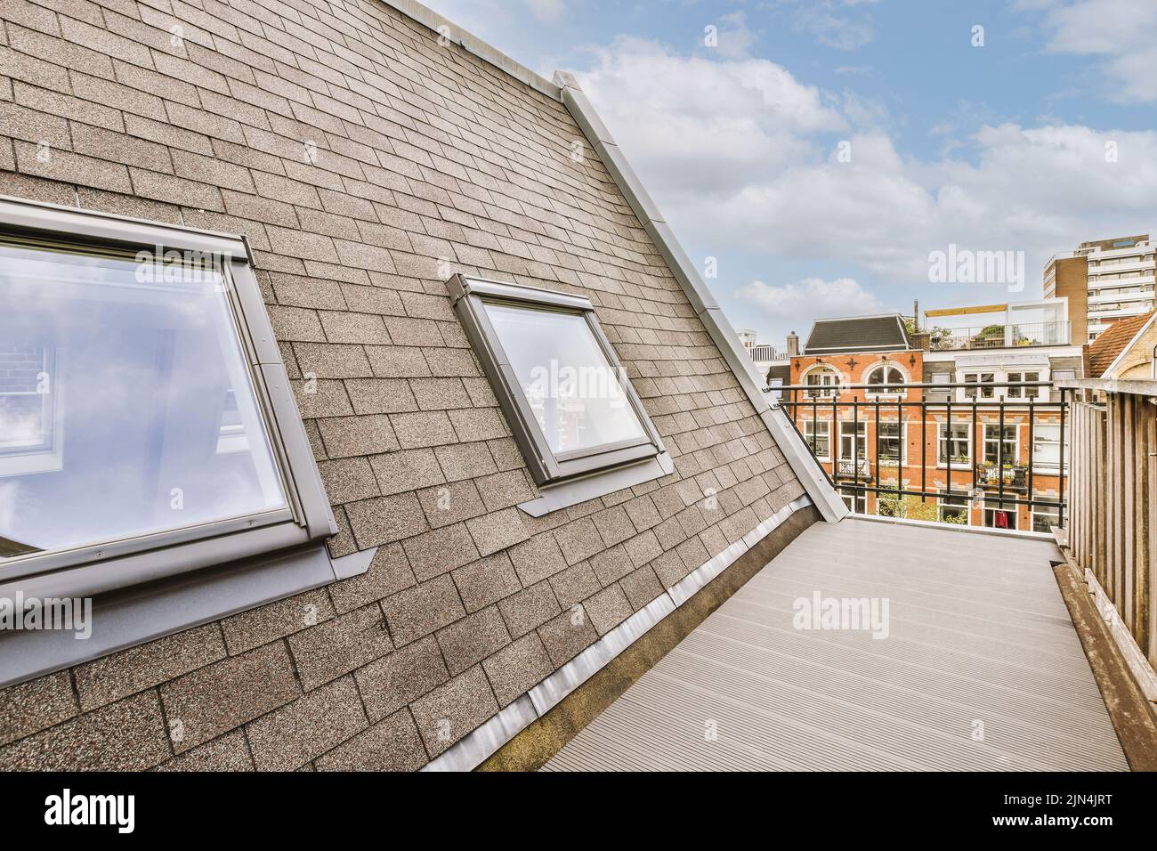 Bright brick balcony with metal railings and door Stock Photo - Alamy