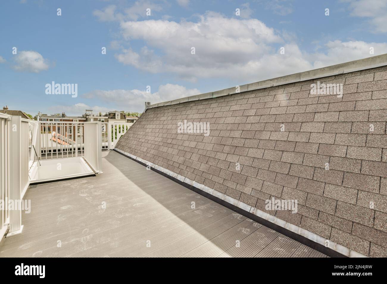Bright brick balcony with metal railings and door Stock Photo - Alamy