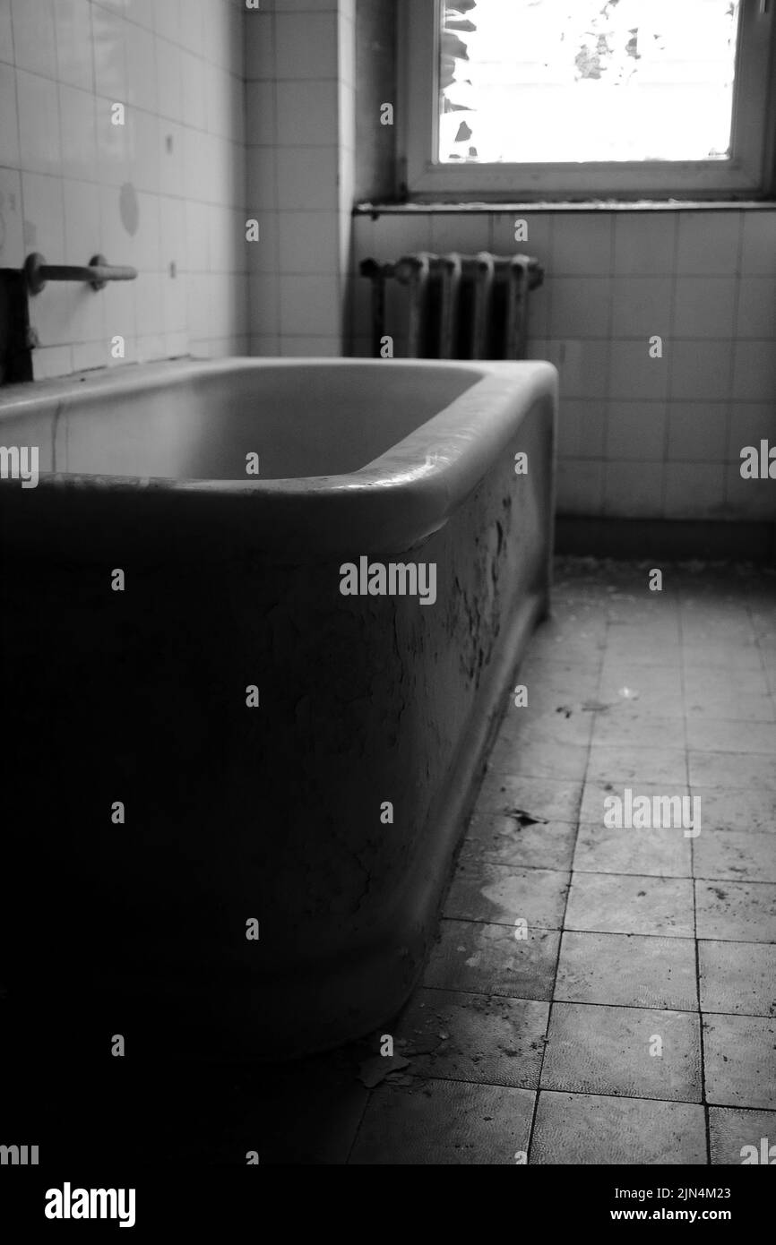 The vertical partial grayscale view of an old bathroom Stock Photo - Alamy