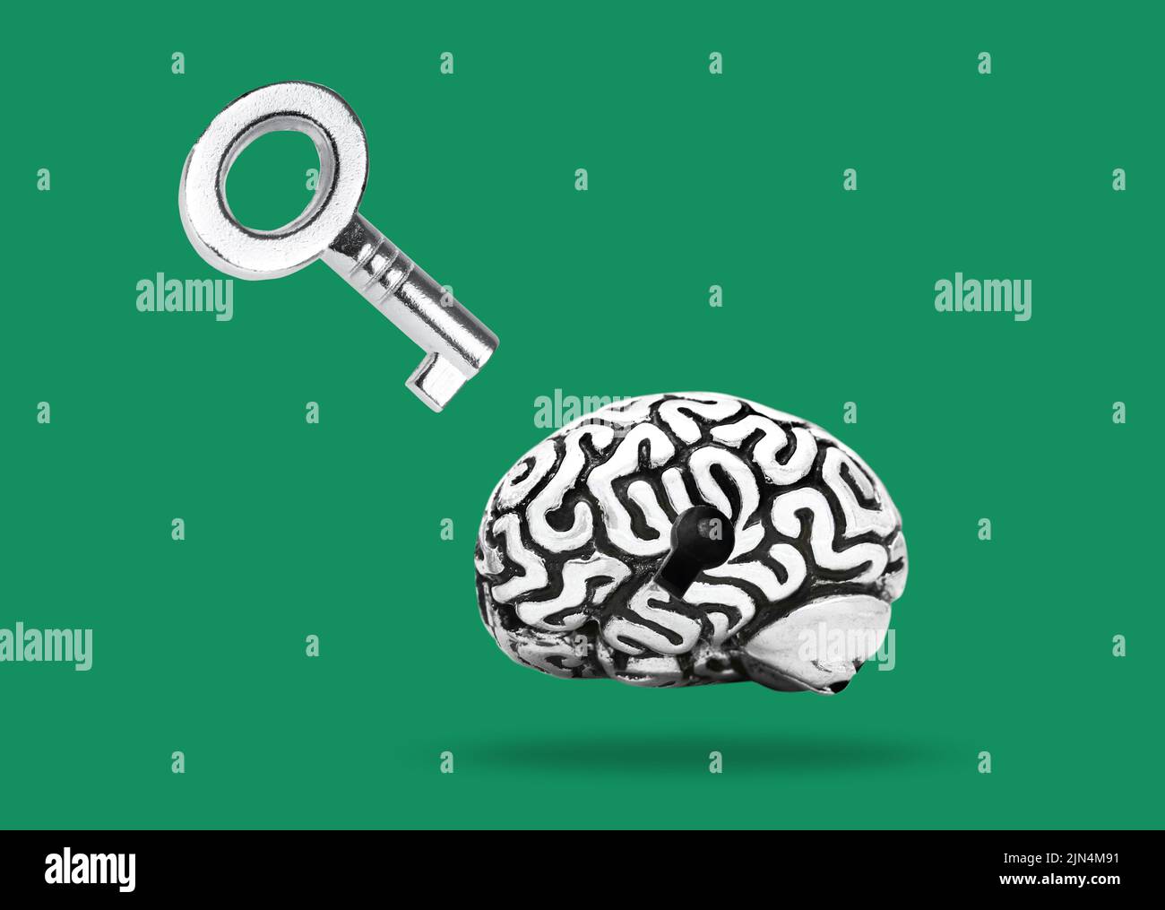 Silver key floating over a human brain copy with a keyhole isolated on ...