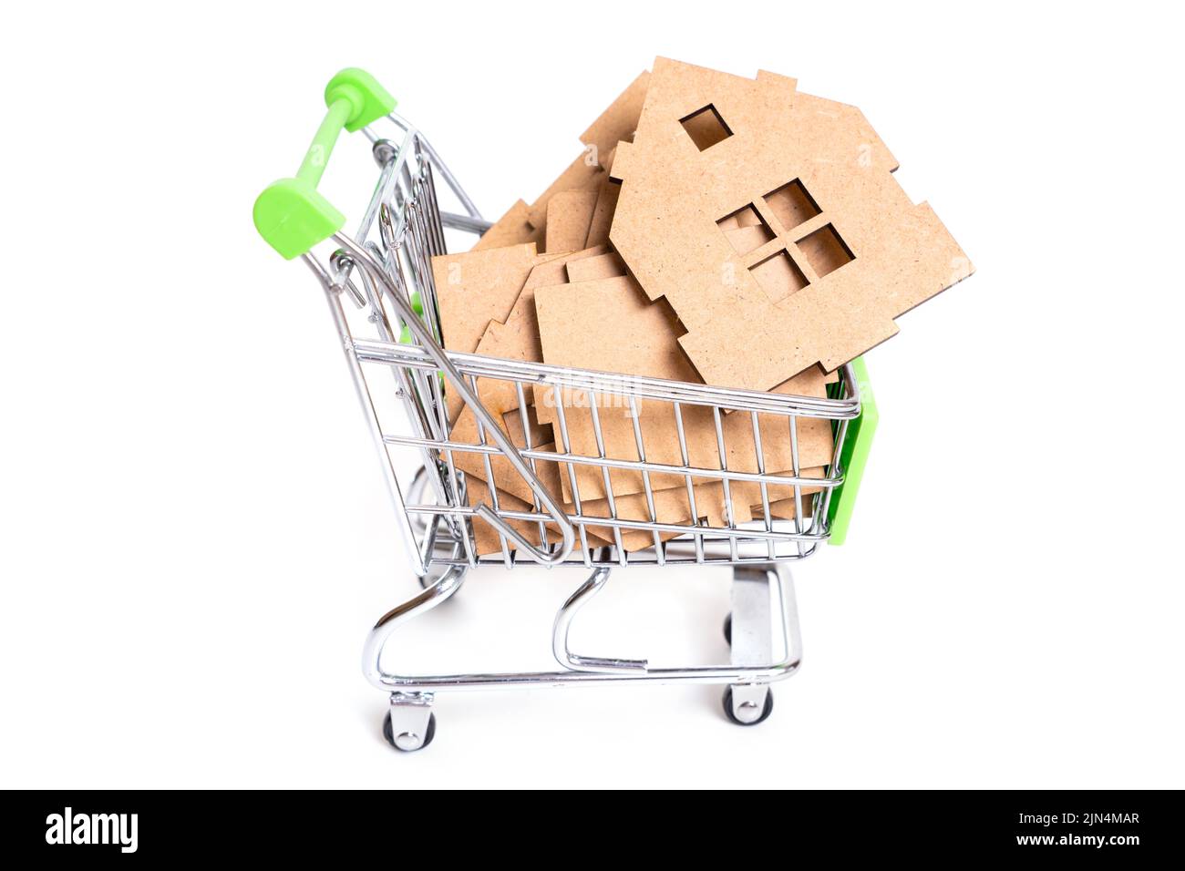 Parts of a miniature wooden house in a small push cart isolated on ...
