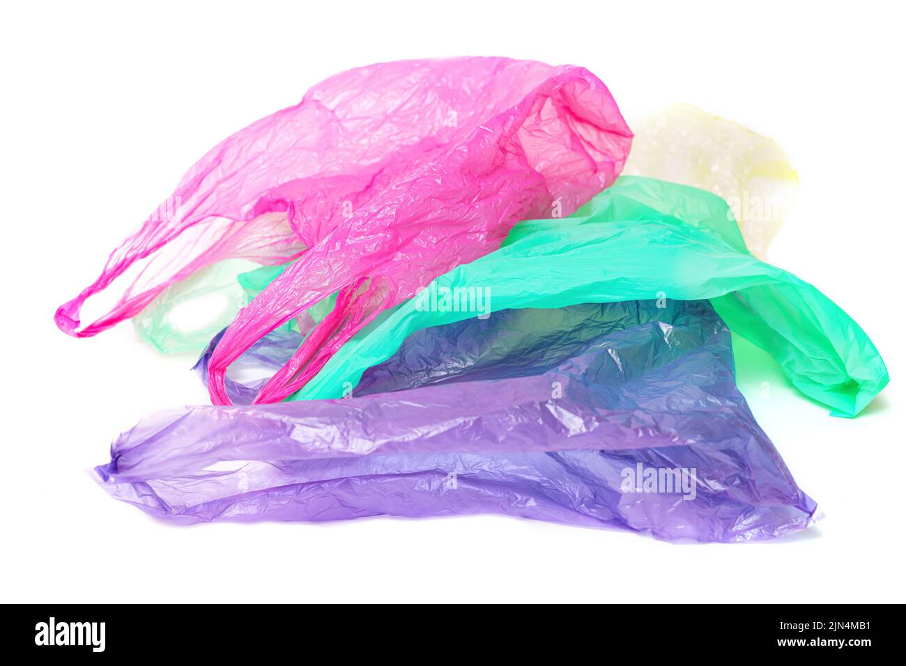Pile of used multicolored disposable bags isolated on white background ...