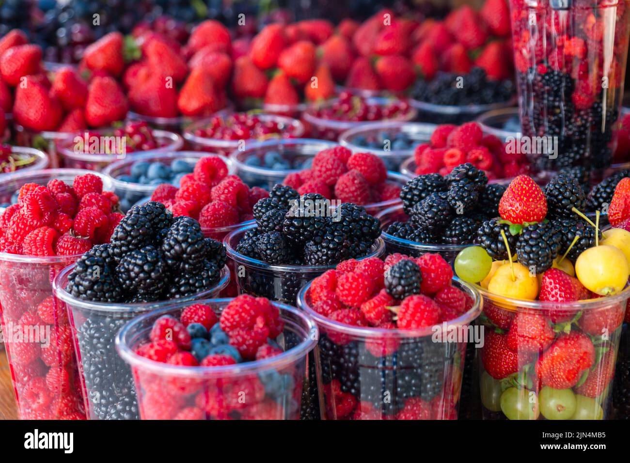 Fresh juicy berries on farmer market, Colorful different fruit sets at ...