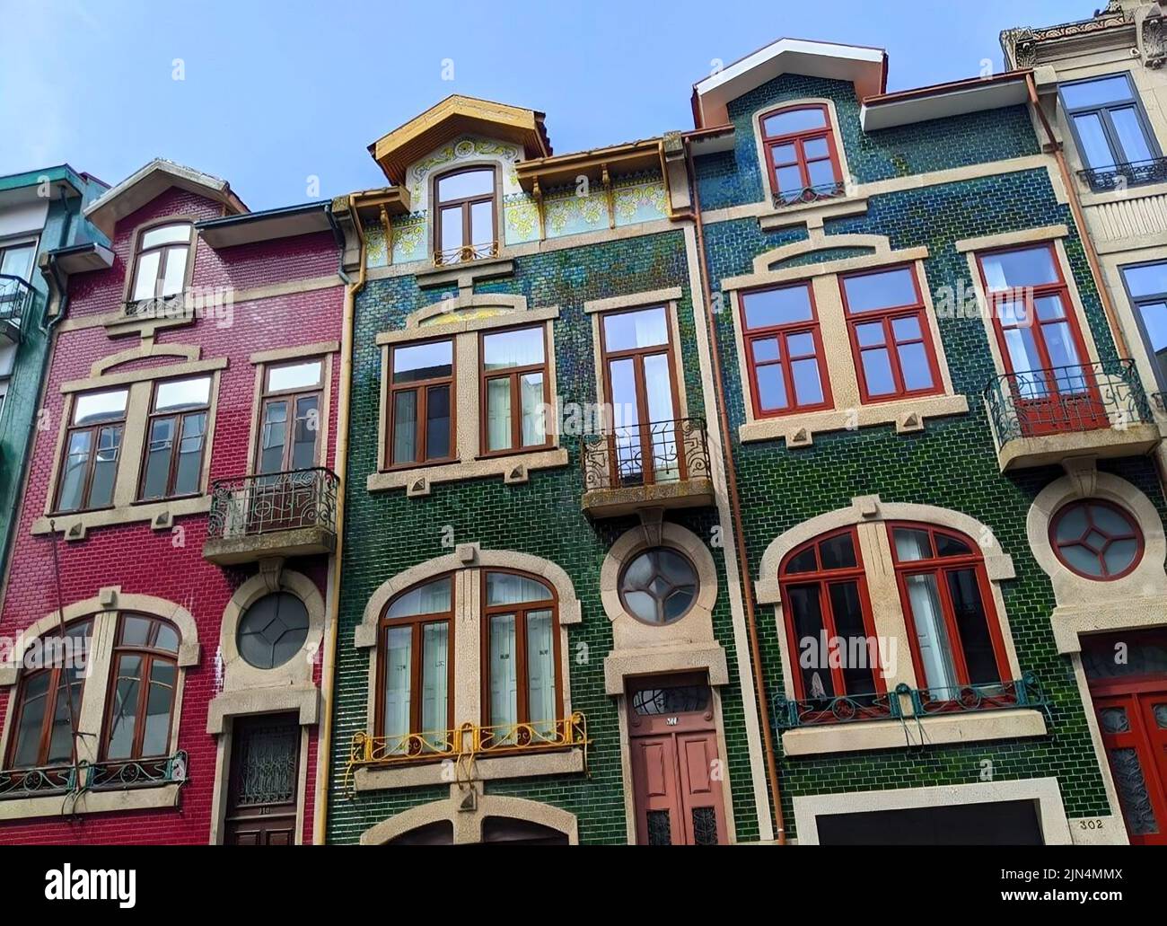 An exterior view of colorful building with traditional wooden window ...