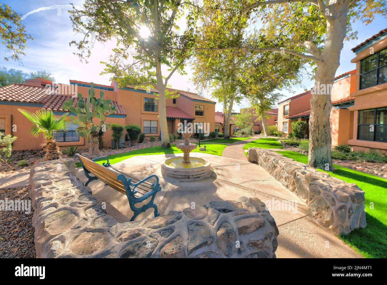 Bench near the small fountain outside the residences with italianate ...