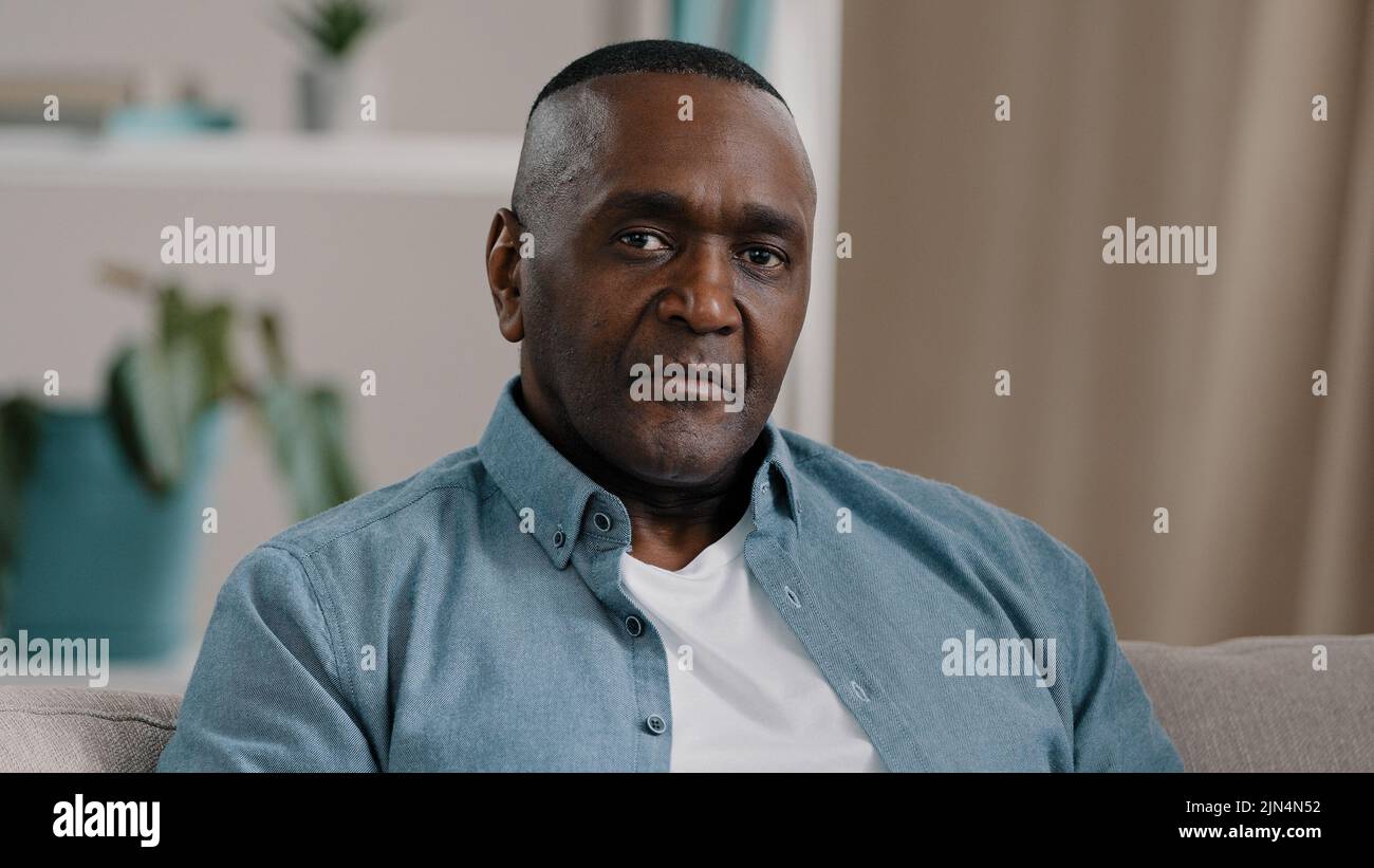 Upset male Serious african american mature professional man looking at ...