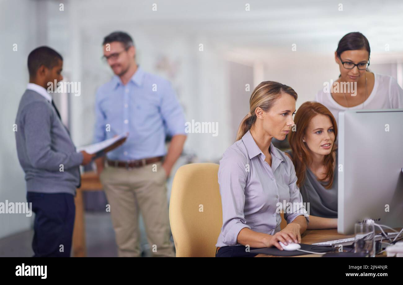 Group of employees at work talking, collaborating, and brainstorming on ...
