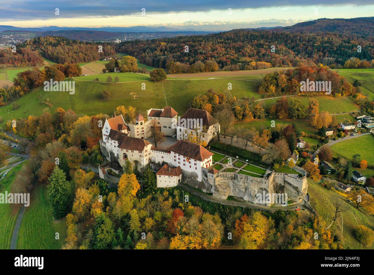 An aerial view of Lenzburg castle surrounded by autumn trees in Aargau ...