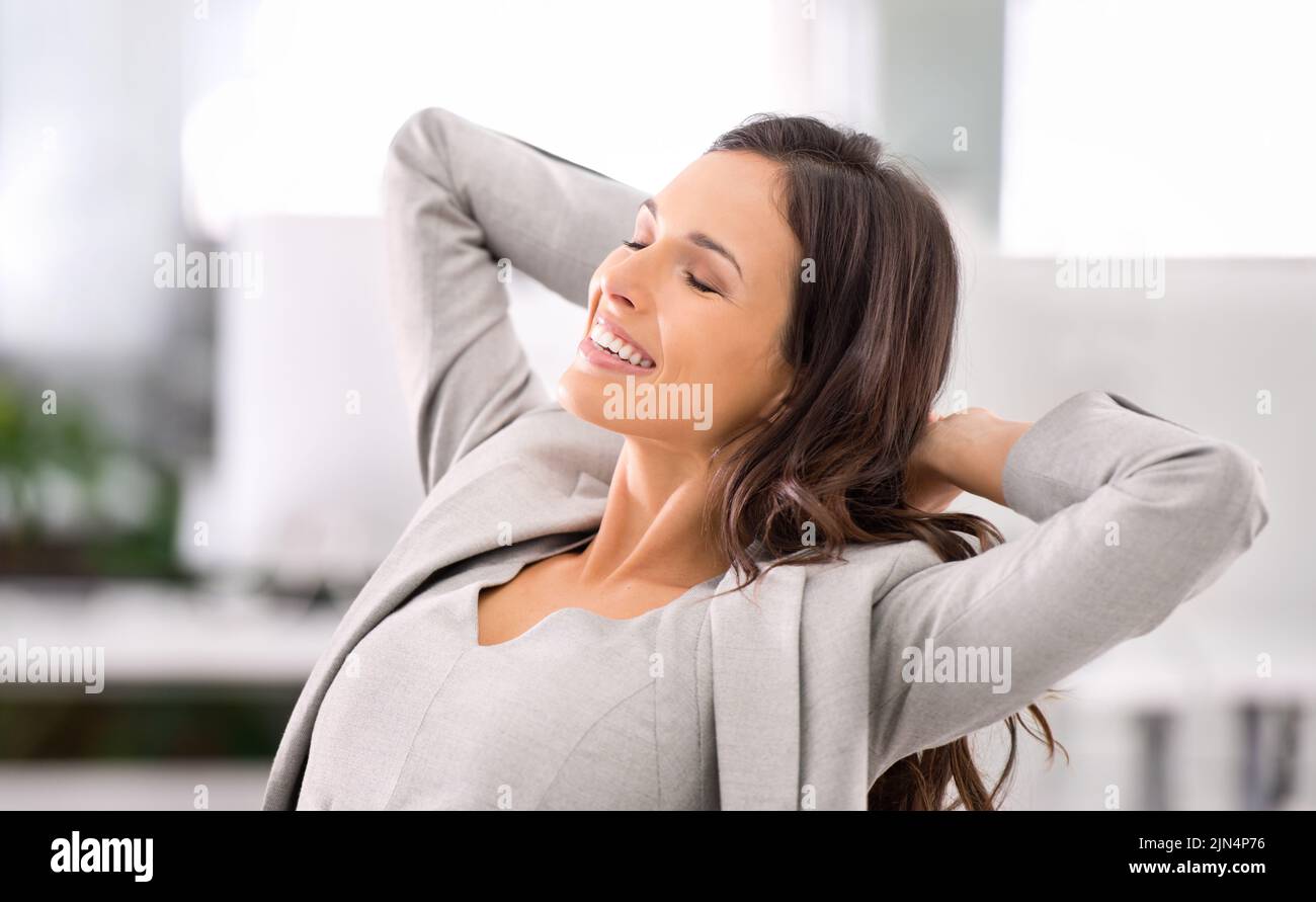 Happy, calm and relaxed businesswoman smiling feeling stress free ...