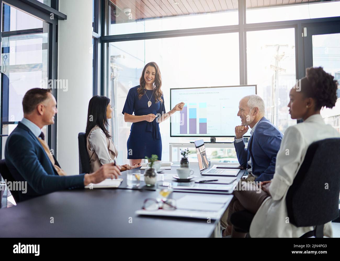 Businesswoman analysis giving a statistic presentation in a diverse ...