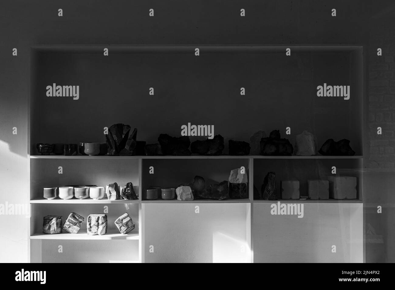 A cupboard with dishes in building in black and white Stock Photo - Alamy