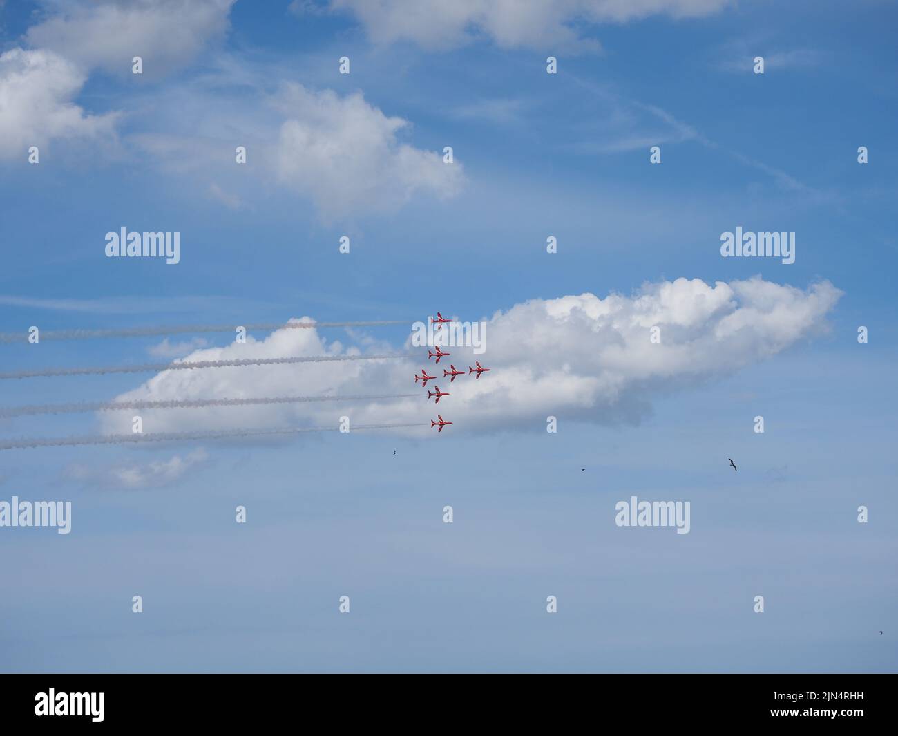 The ref air force planes in the blue cloudy sky Stock Photo - Alamy