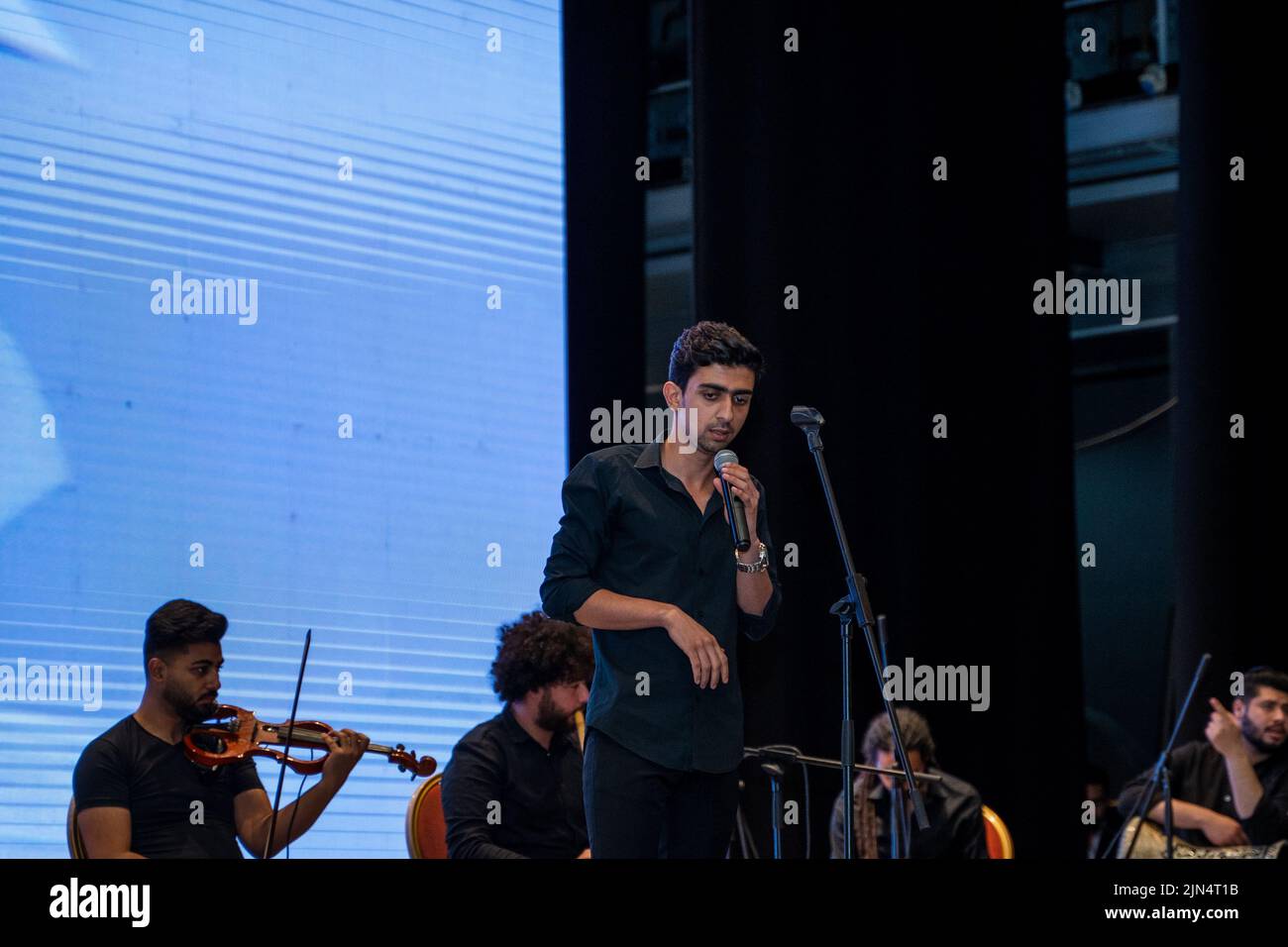 Singers On Stage From Behind