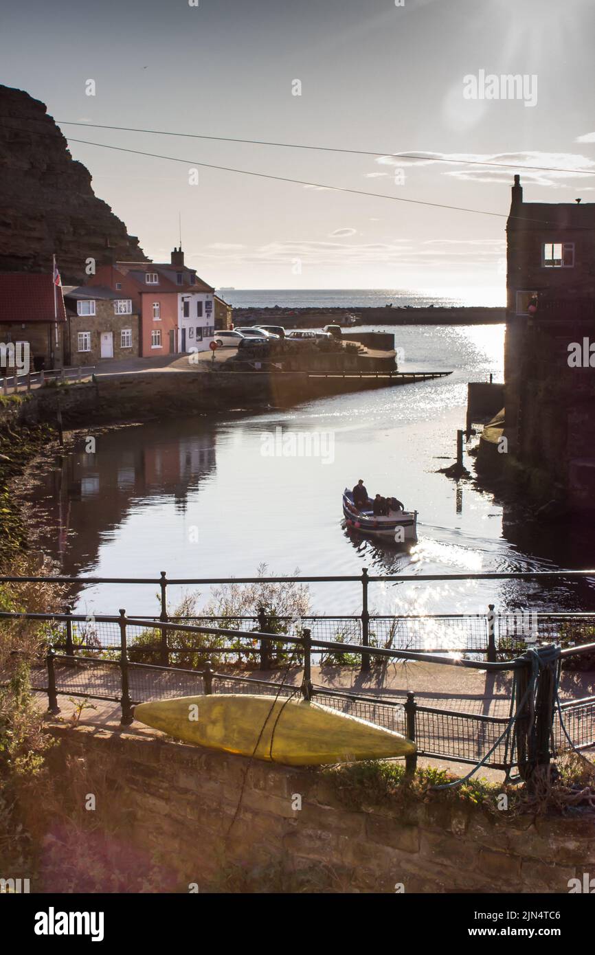 Fishing boat setting out early morning Stock Photo - Alamy