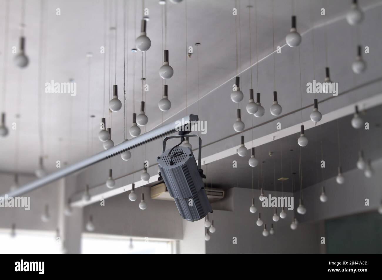 Tracking spotlight on the ceiling rail system and round ceiling lamps ...