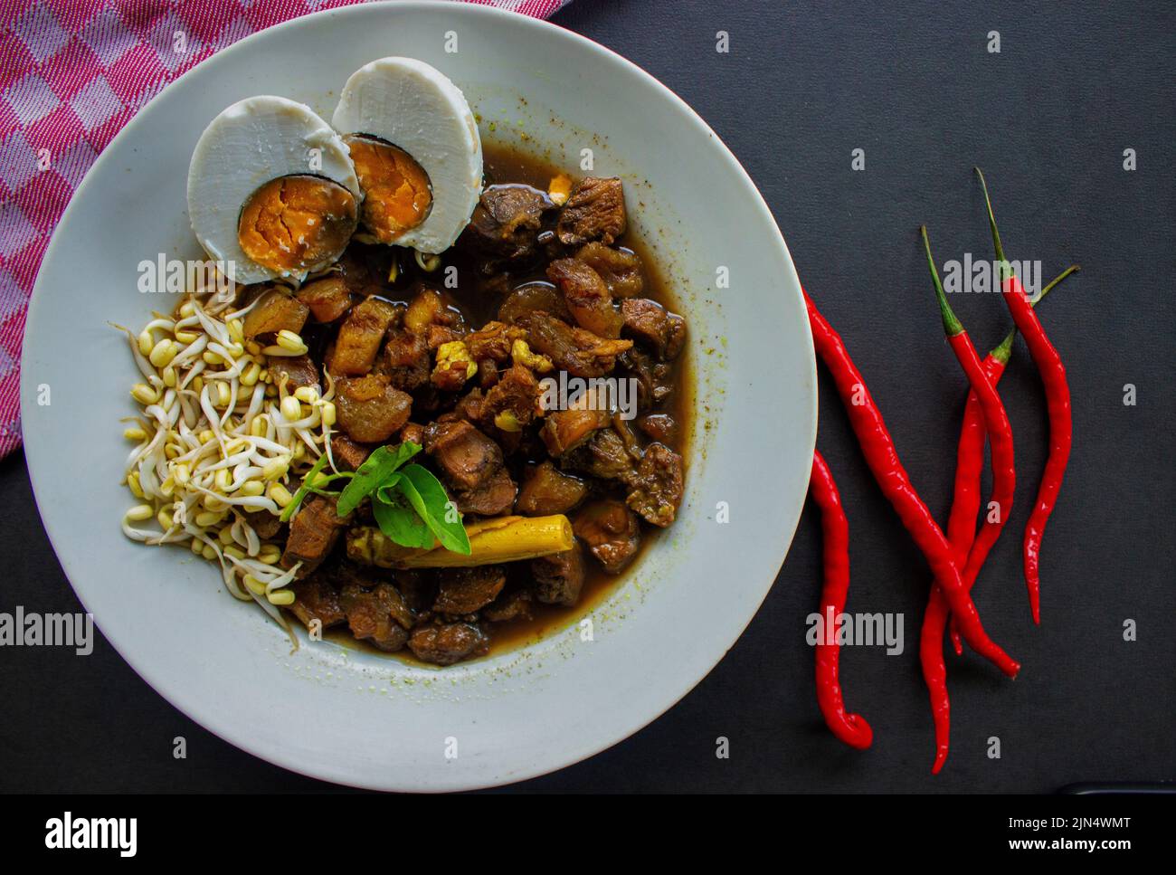 Rawon or Nasi Rawon/Rawon Rice is traditional Indonesian beef black ...