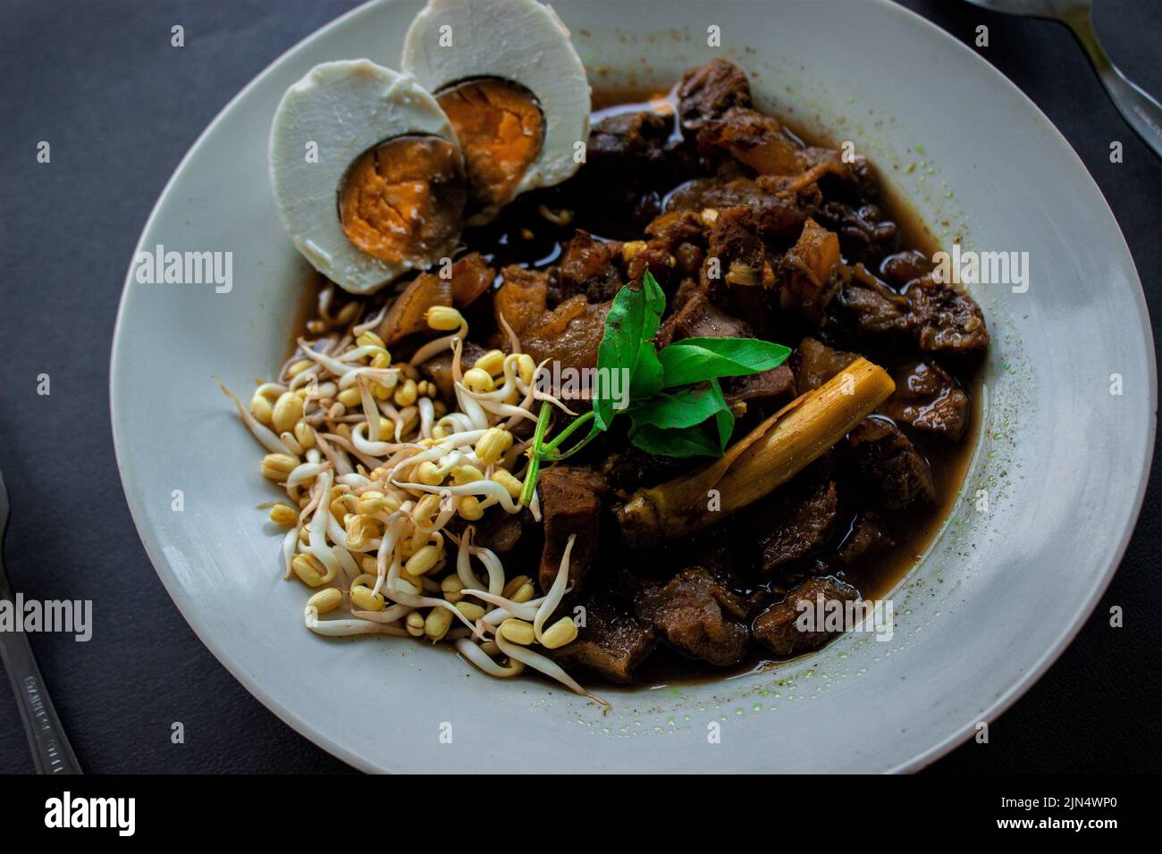 Rawon or Nasi Rawon/Rawon Rice is traditional Indonesian beef black ...