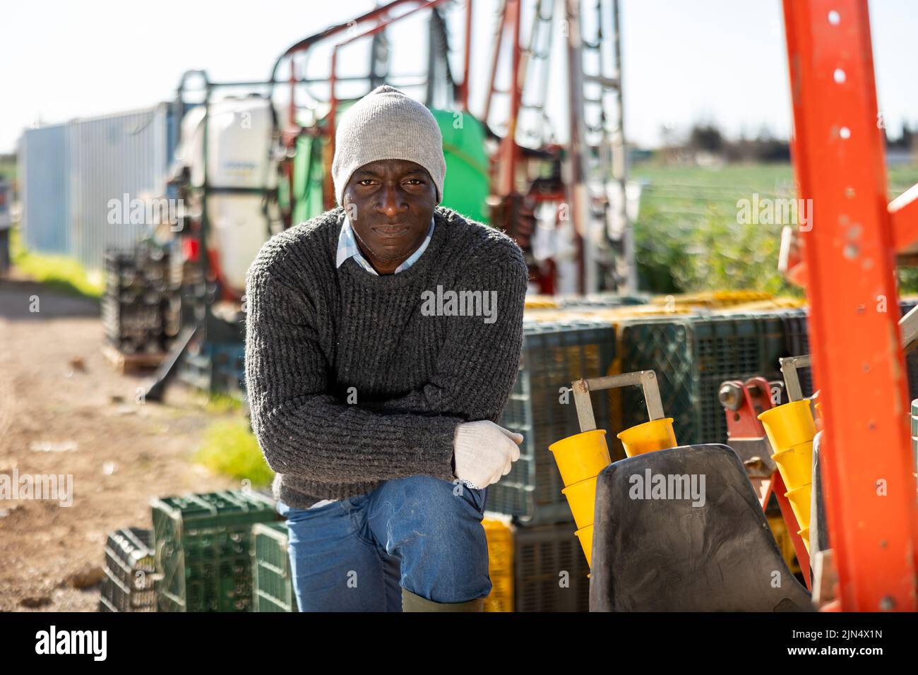 Male tractor driver in farm backyard Stock Photo - Alamy