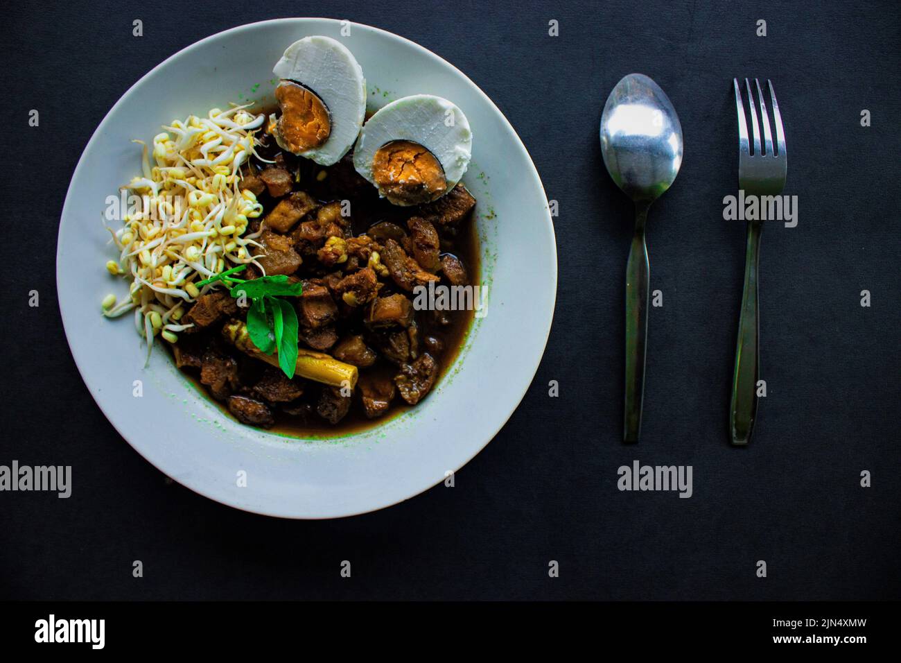 Rawon or Nasi Rawon/Rawon Rice is traditional Indonesian beef black ...