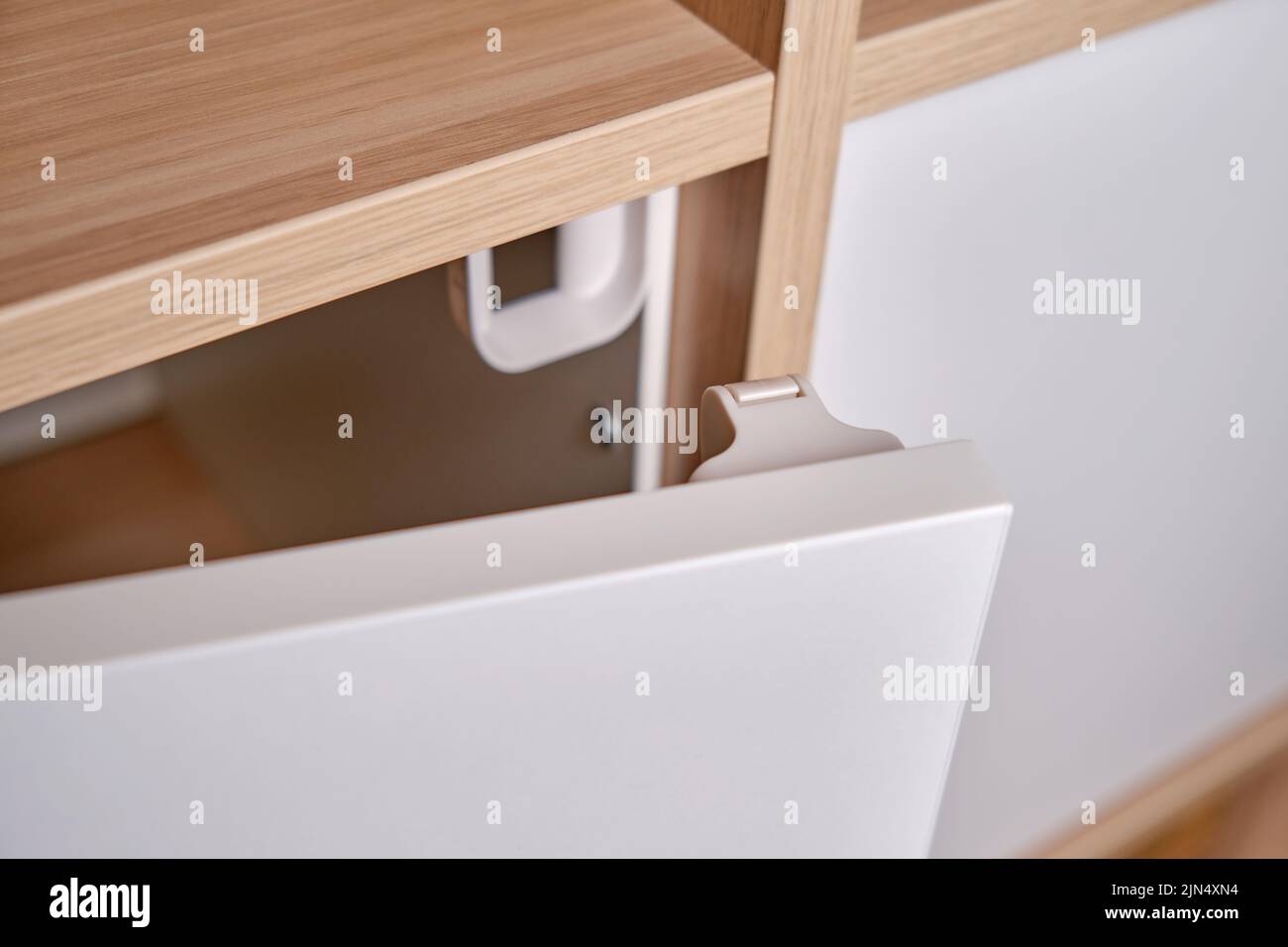 Magnetic child-proof lock for locking cabinet doors and drawers of home furniture Stock Photo ...