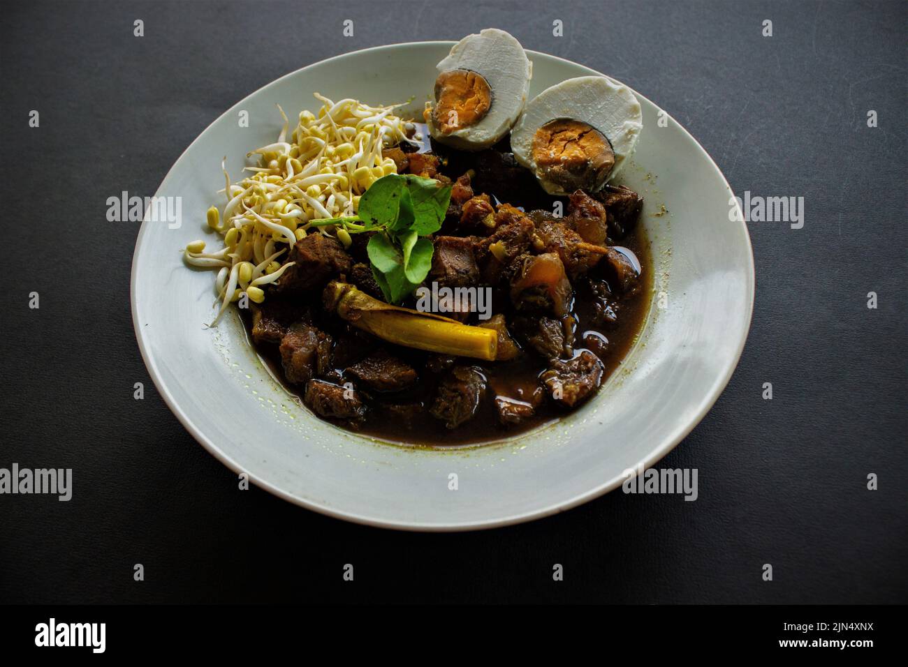 Rawon or Nasi Rawon/Rawon Rice is traditional Indonesian beef black ...