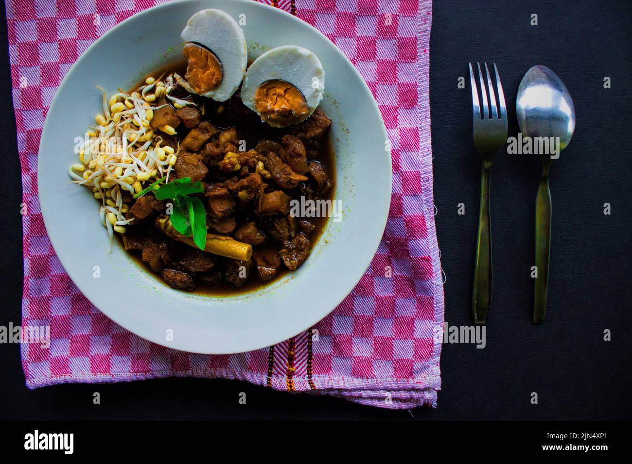 Rawon or Nasi Rawon/Rawon Rice is traditional Indonesian beef black ...