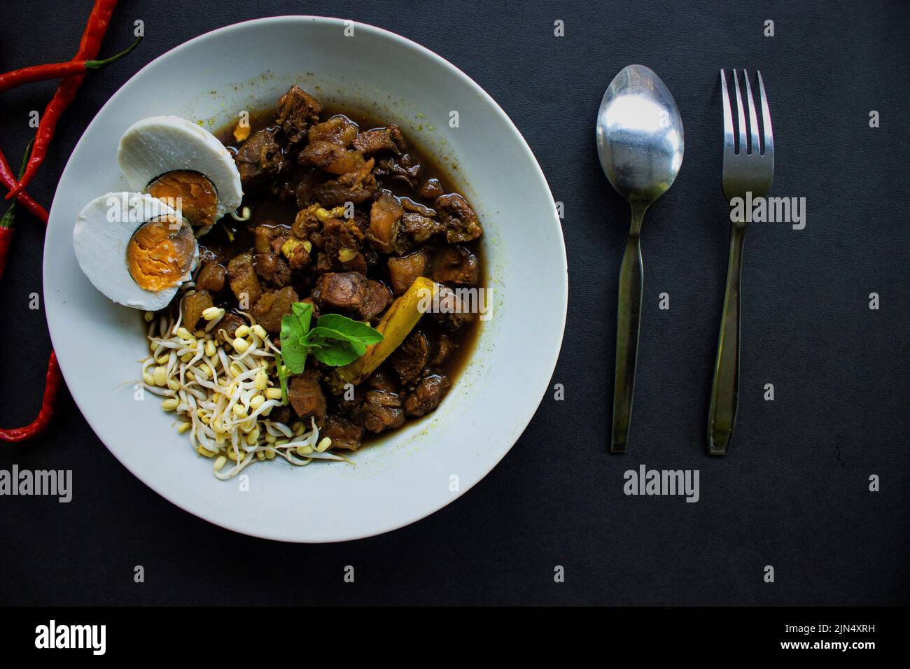 Rawon or Nasi Rawon/Rawon Rice is traditional Indonesian beef black ...