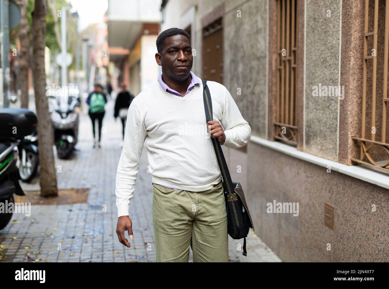 African-american man through city streets Stock Photo - Alamy