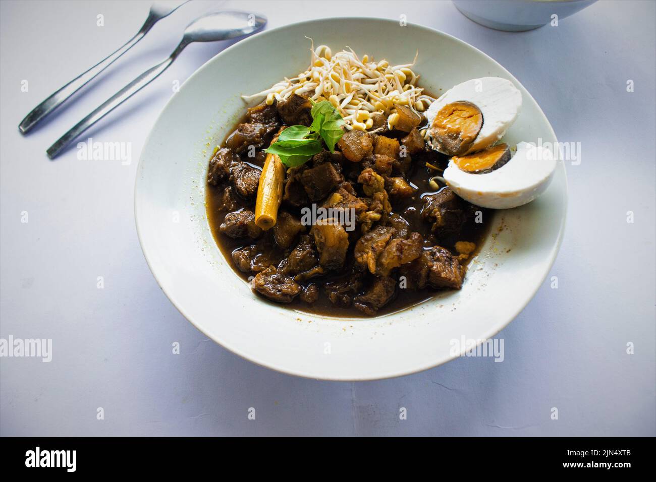 Rawon or Nasi Rawon/Rawon Rice is traditional Indonesian beef black ...