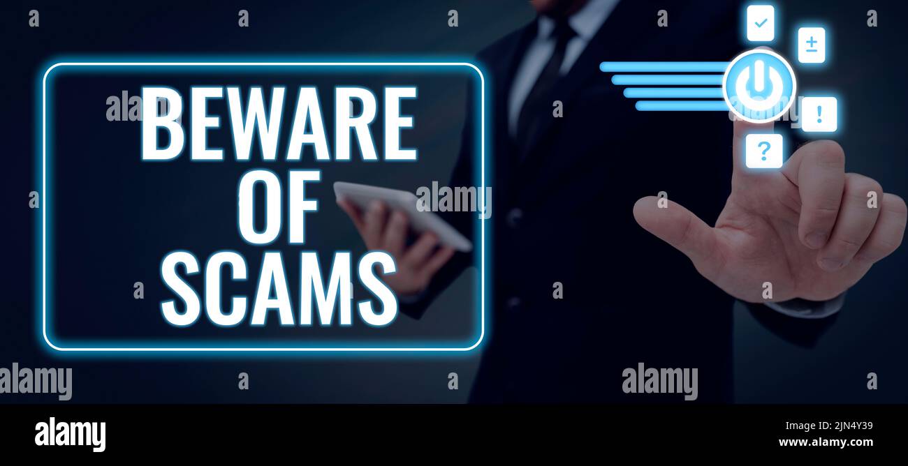 Sign displaying Beware Of Scams. Word for Stay alert to avoid fraud ...