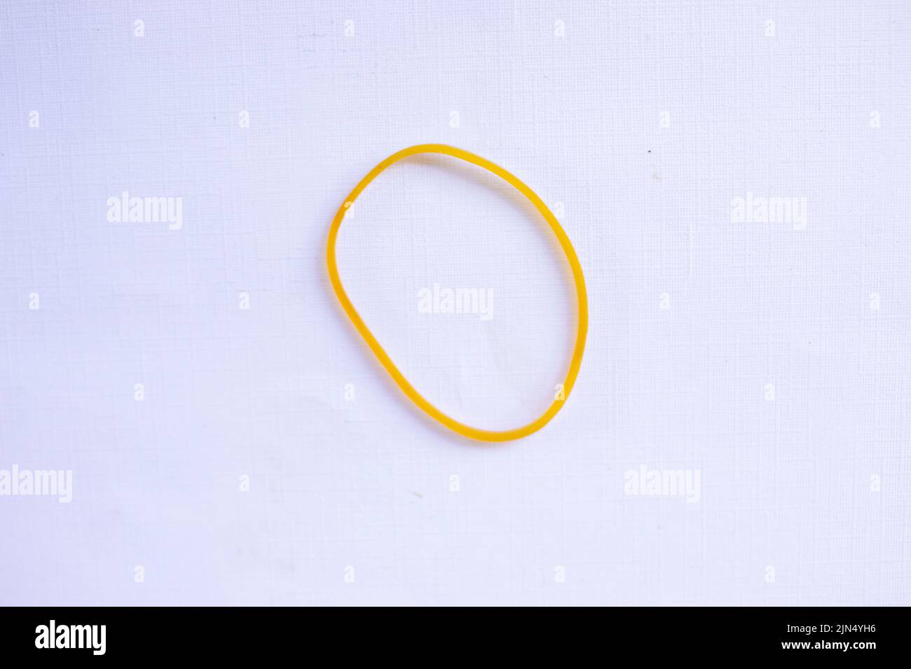 Red rubber band. Elastic bands. dragging an elastic band, isolated on ...